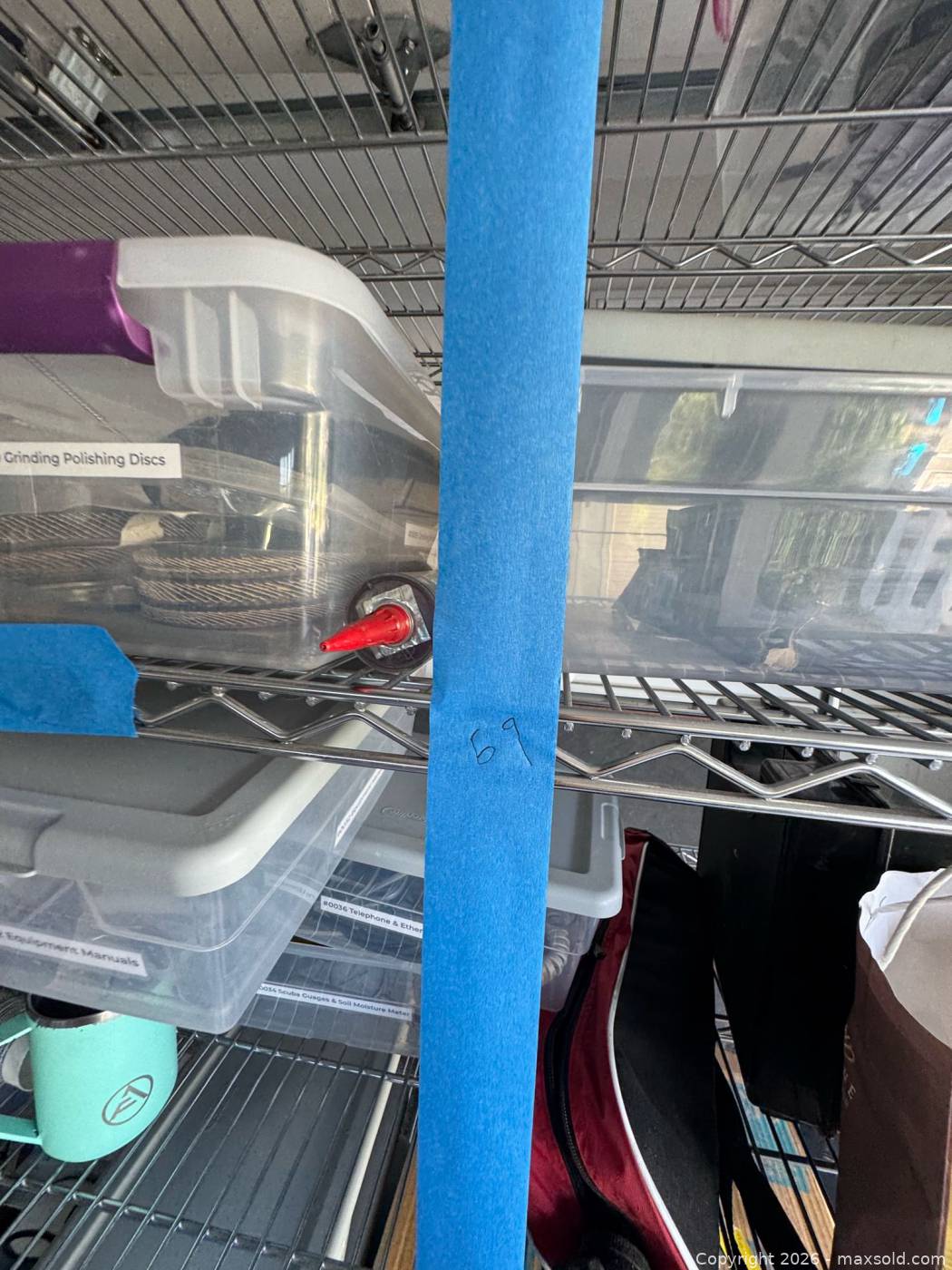 Garage tools and misc storage bins | Maxsold