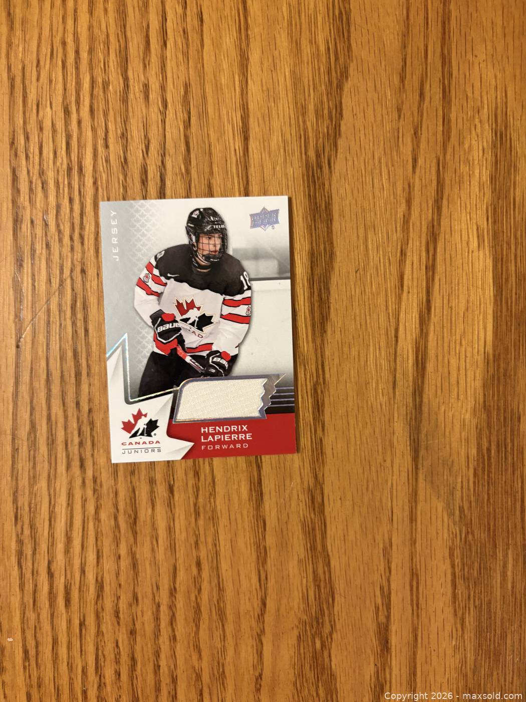 Hendrix Lapierre jersey trading card | Maxsold