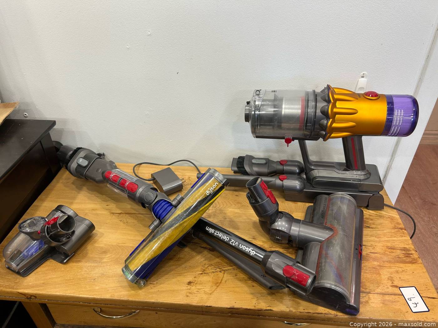 Dyson cordless vacuum with attachments | Maxsold