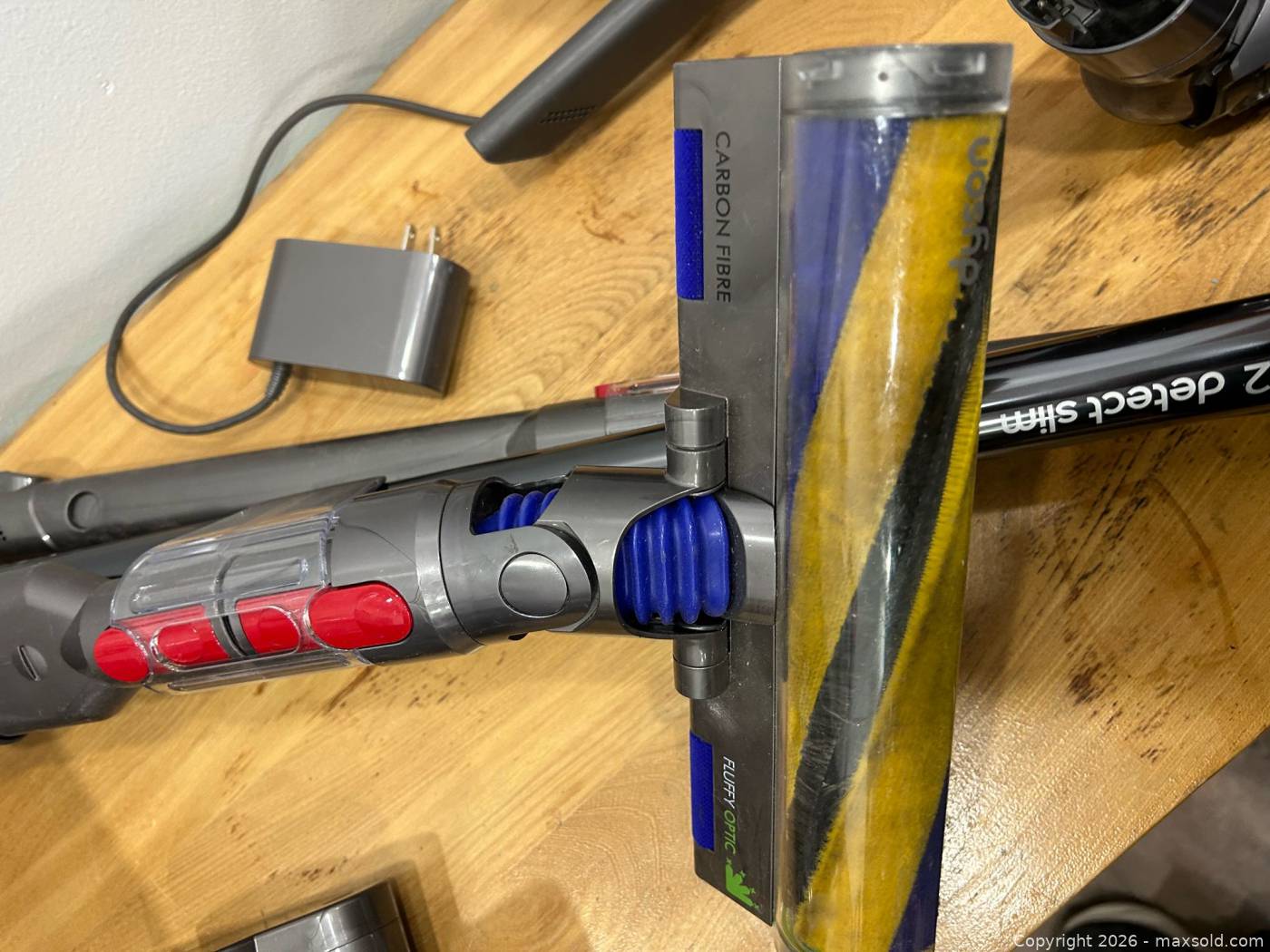 Dyson cordless vacuum with attachments | Maxsold