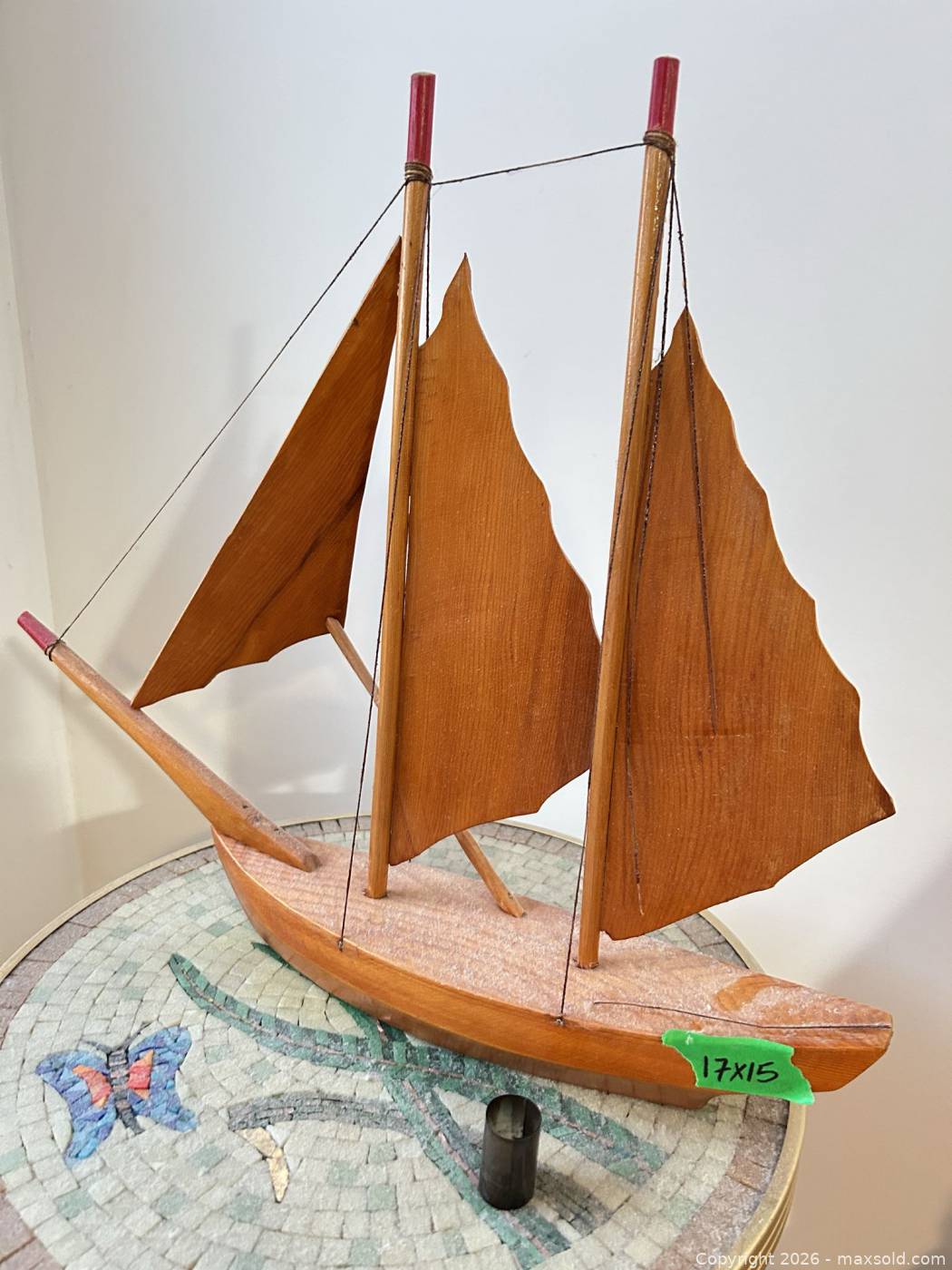 Mosaic tile side table & wooden sailboat | Maxsold