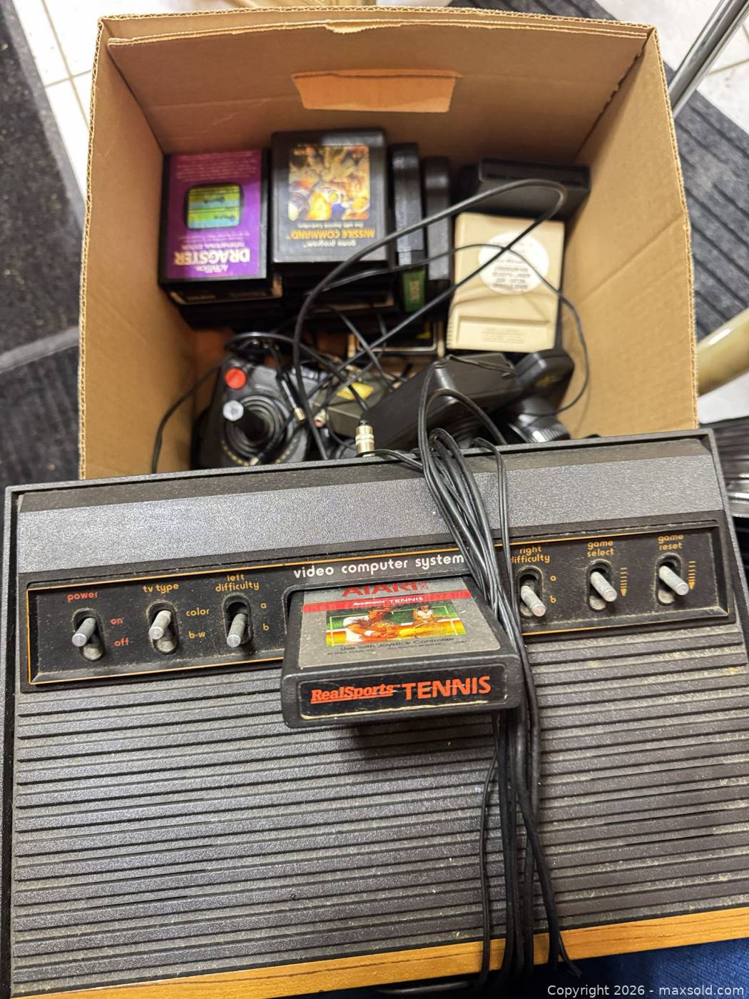Atari 2600 console, controllers, cartridges | Maxsold