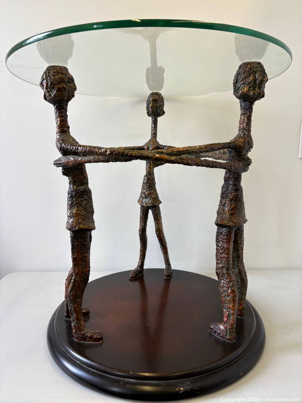 Brutalist metal figures glass pedestal table | Maxsold