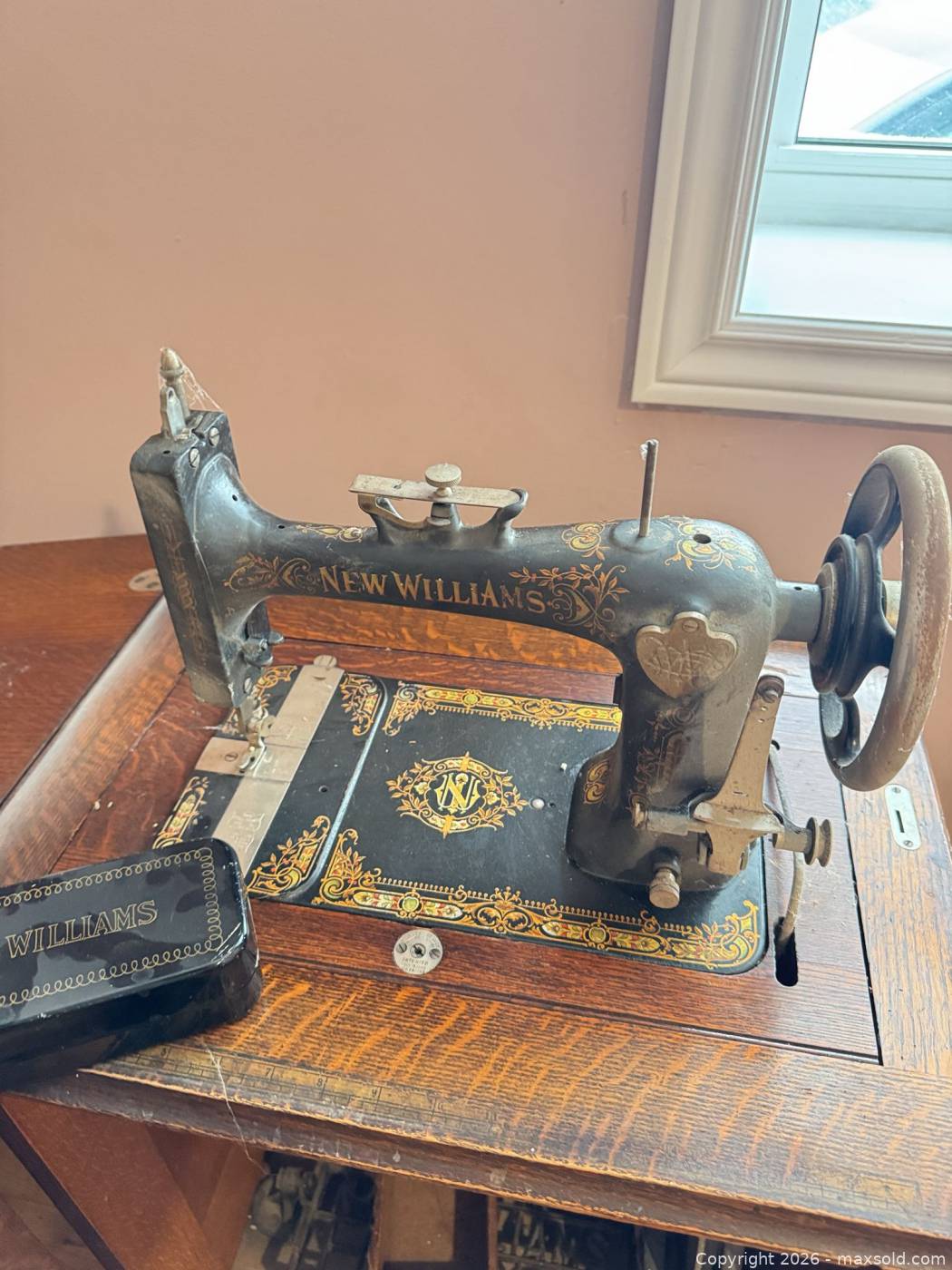 New Williams treadle sewing machine in cabinet with accessories | Maxsold