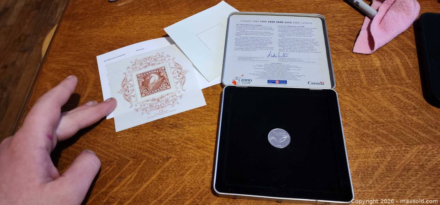 Canada Post 2000 Millennium coin & stamp set | Maxsold