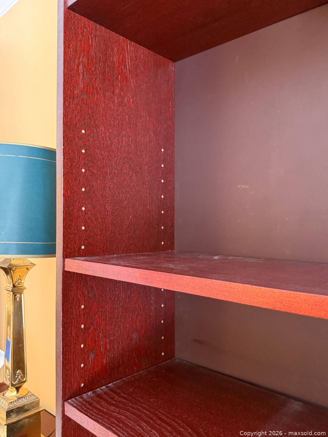 Tall and small red faux oak veneer bookcases | Maxsold