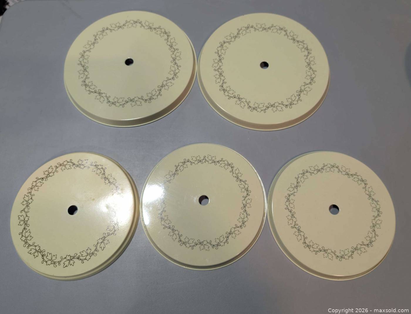 Vintage cream metal stovetop burner covers with vine pattern, five ...