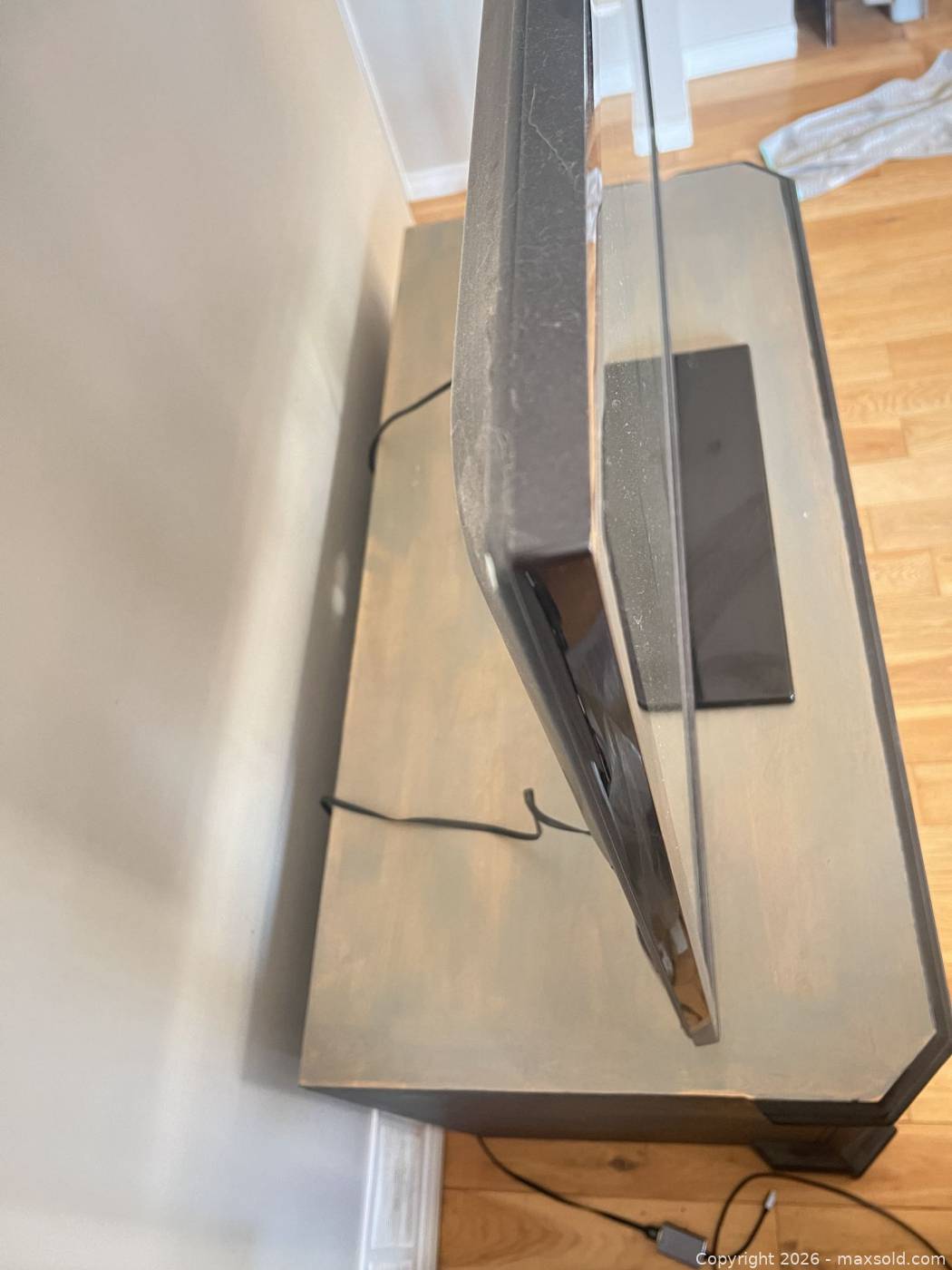 Two-tone TV stand with glass-panel doors | Maxsold