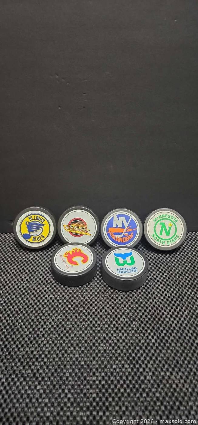6 NHL logo official game hockey pucks | Maxsold