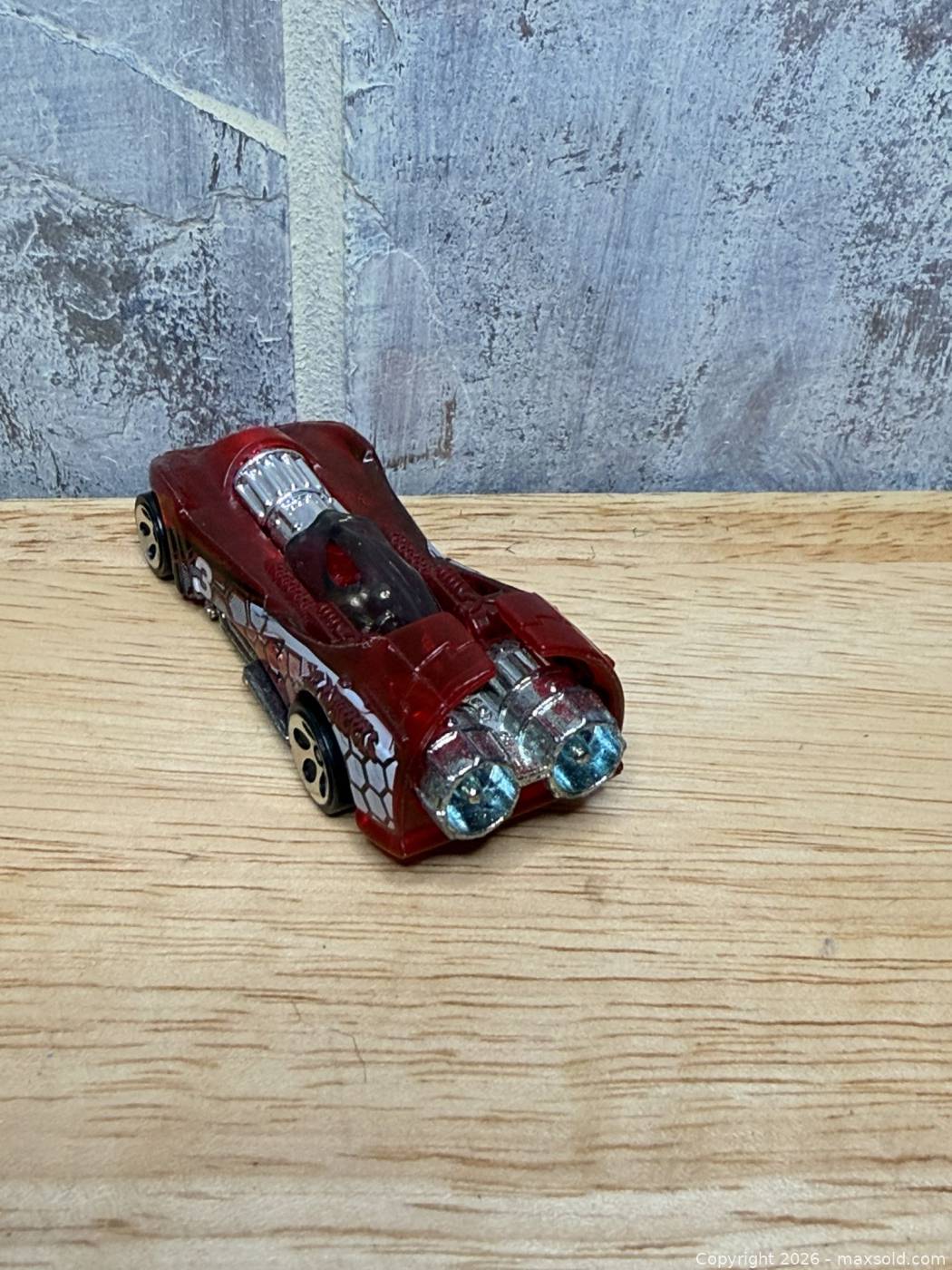Hot Wheels translucent red die-cast toy car | Maxsold