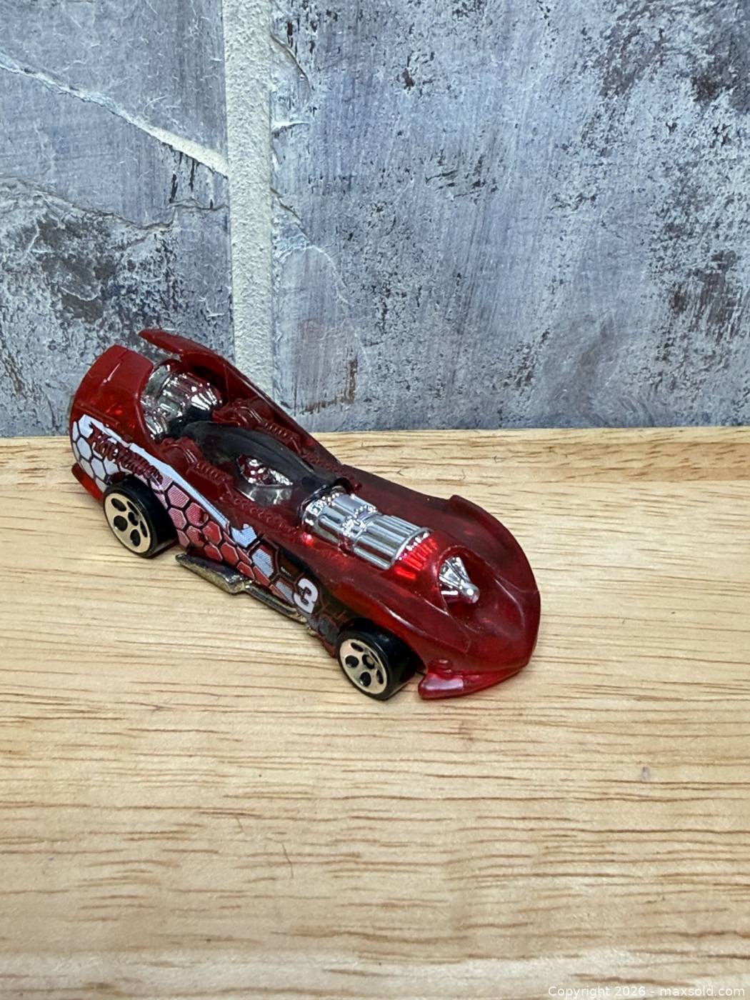 Hot Wheels translucent red die-cast toy car | Maxsold