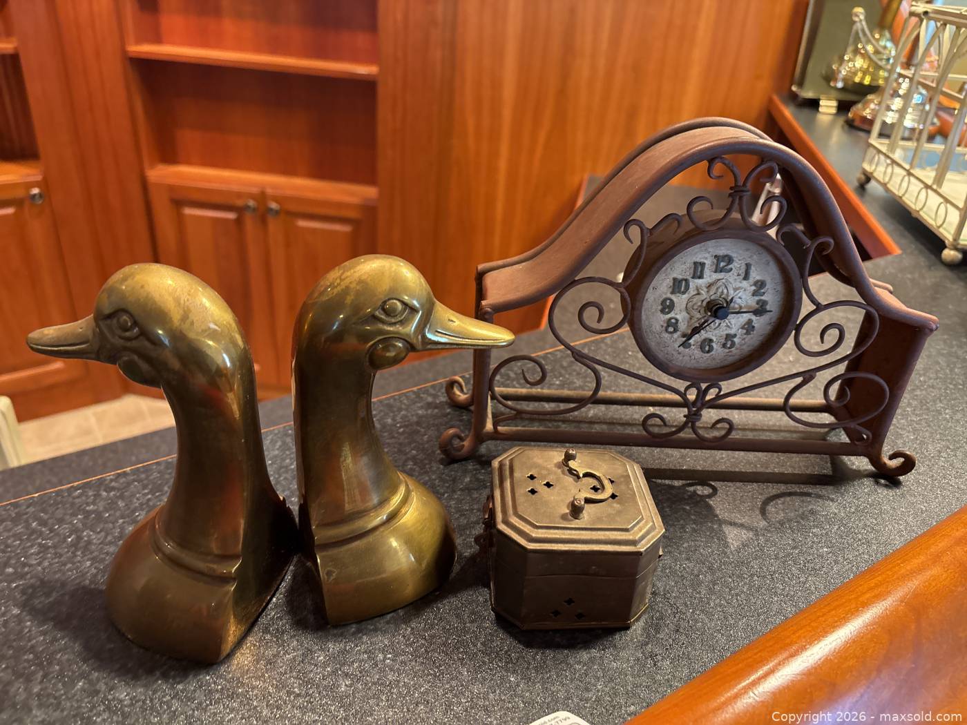 Brass duck head bookends, pierced brass box, copper scroll mantel clock ...