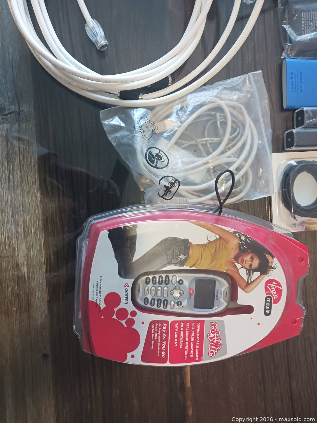 Virgin Mobile prepaid cell phone with power banks, cables | Maxsold
