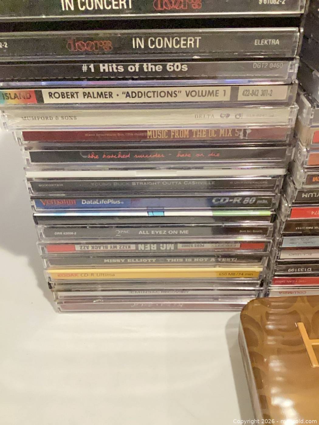 Assorted music CDs and 70s tin box sets | Maxsold