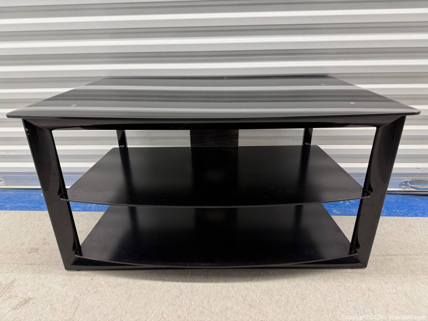 Black smoked glass top media console | Maxsold
