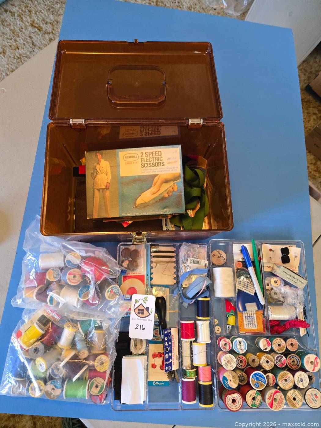 Plastic sewing box with assorted thread and notions | Maxsold