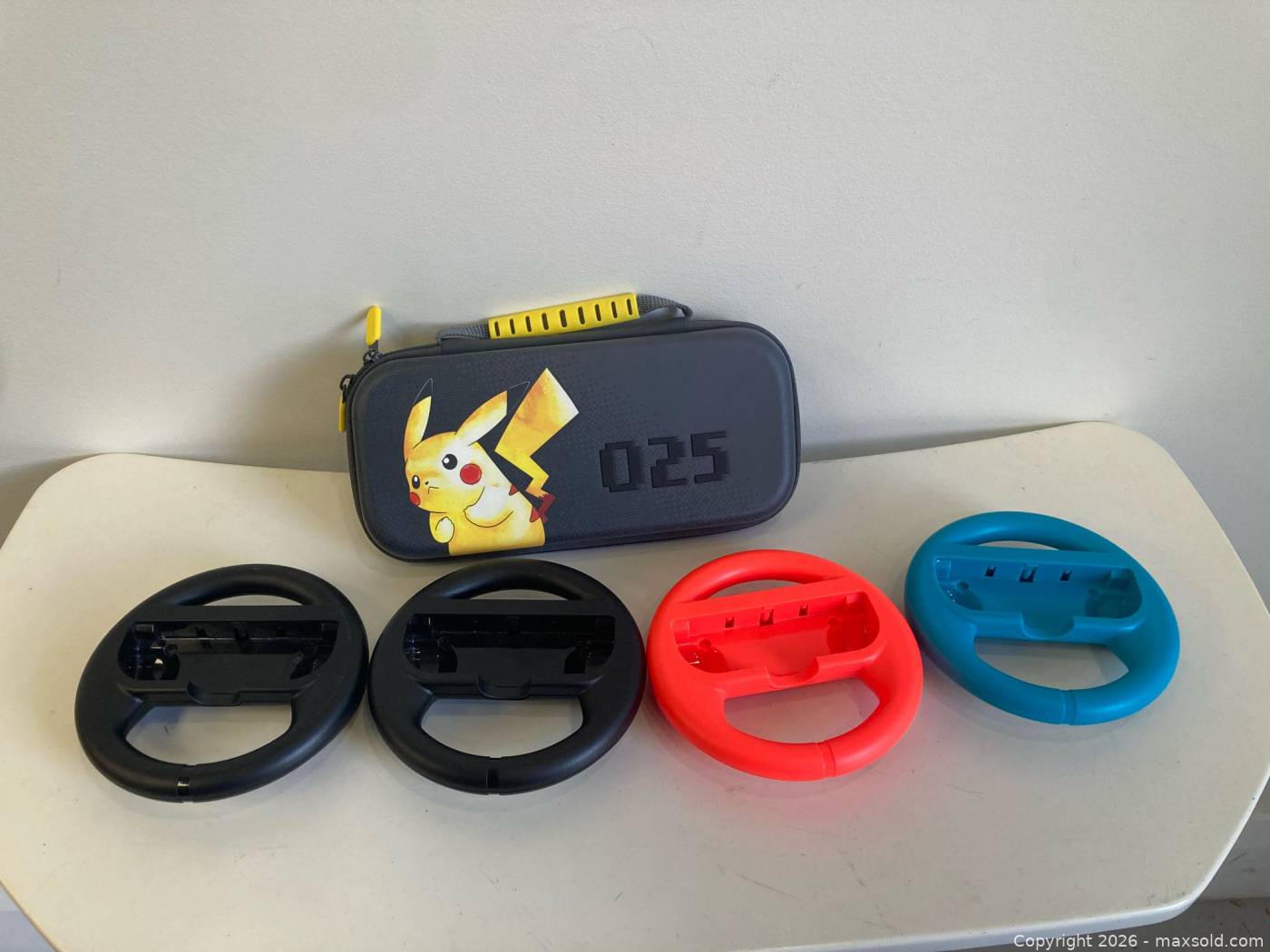 Nintendo Switch Pikachu case plus 4 Joy-Con wheels | Maxsold