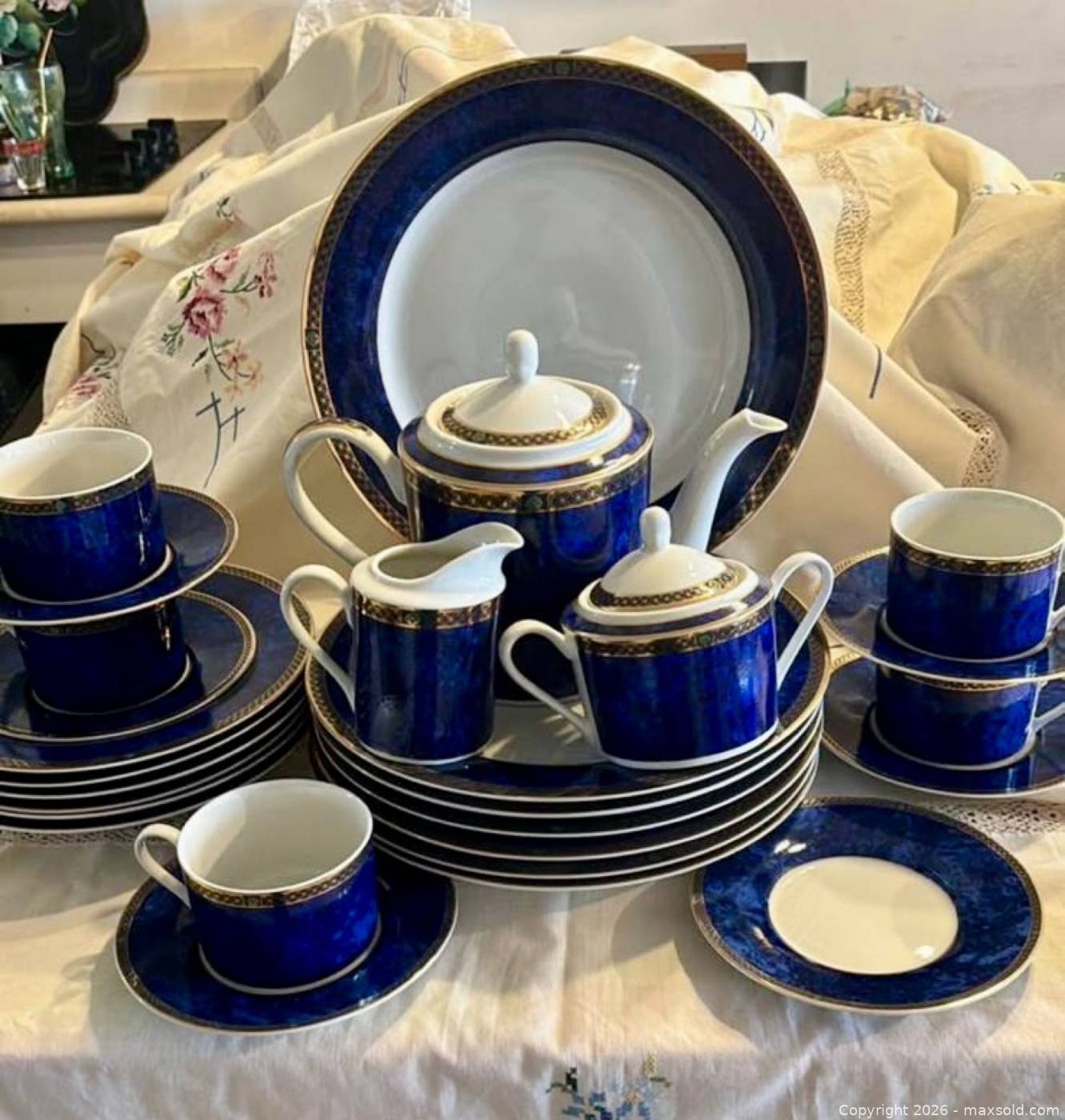 34-piece cobalt blue & gold china dinnerware set | Maxsold