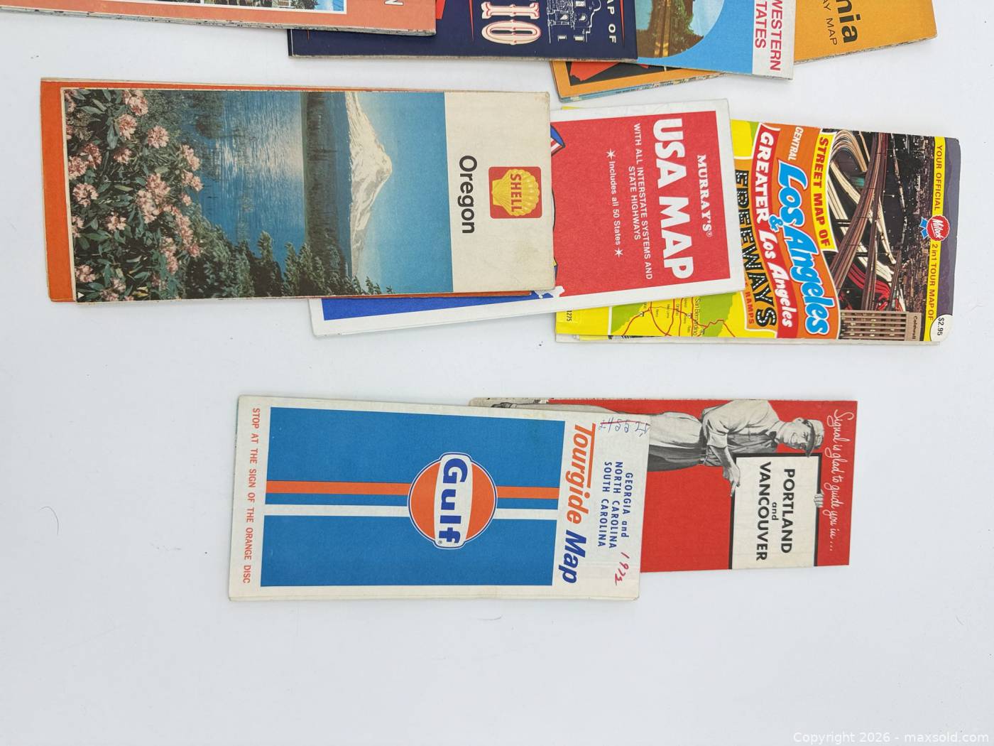 25 vintage folding road maps | Maxsold