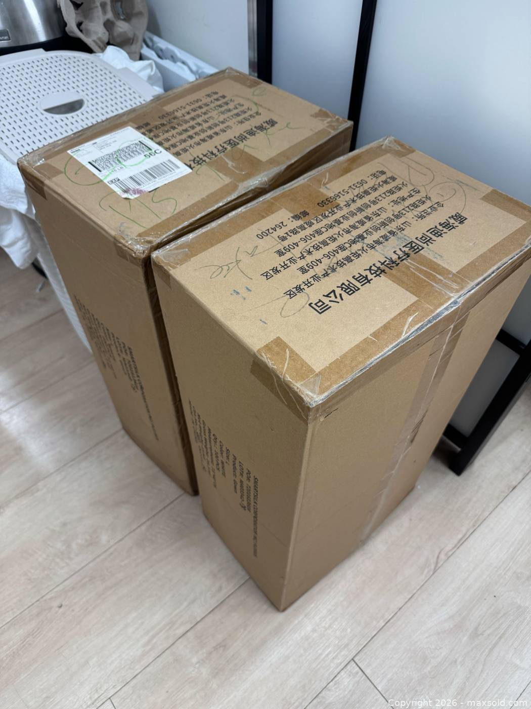 Two sealed boxes of PPE gowns | Maxsold