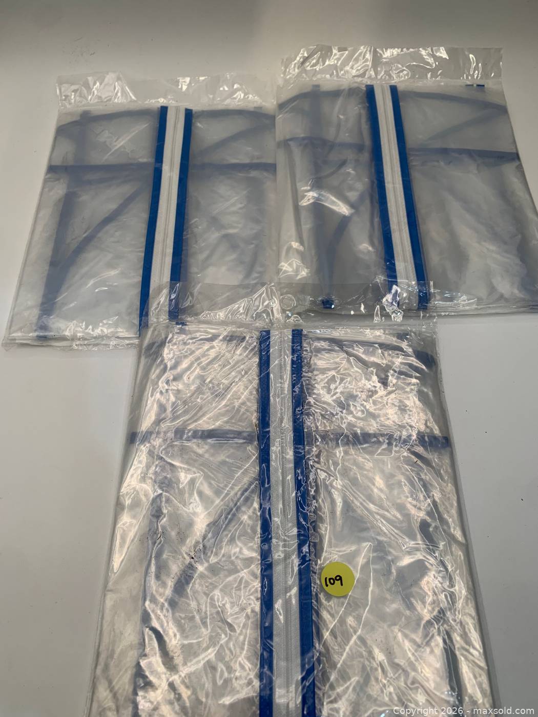 Set of 3 clear PVC suit bags with blue trim | Maxsold