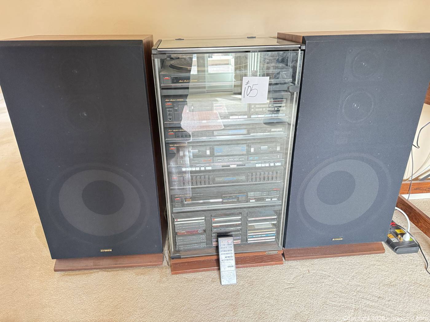 Fisher stereo cabinet system with components | Maxsold