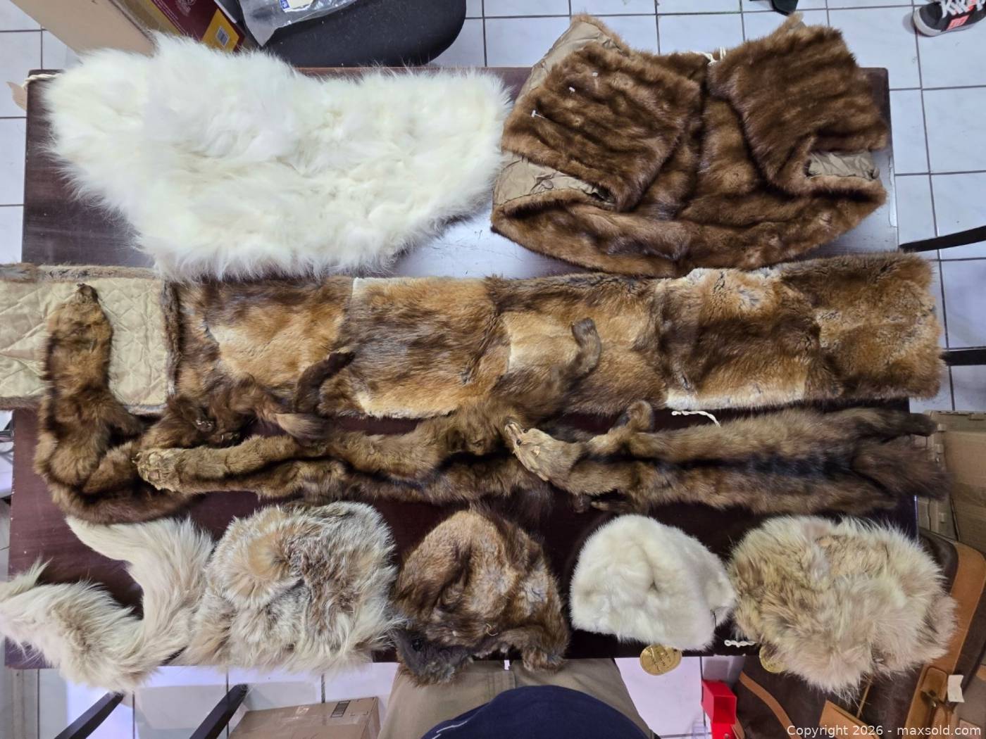 Assorted tanned fur pelts and craft pieces | Maxsold