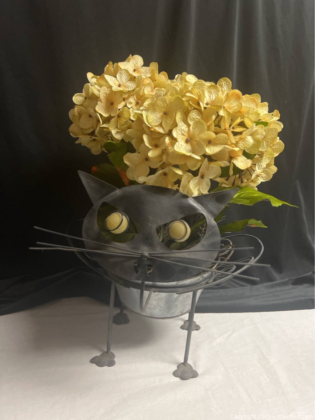 Metal cat planter with faux hydrangeas | Maxsold