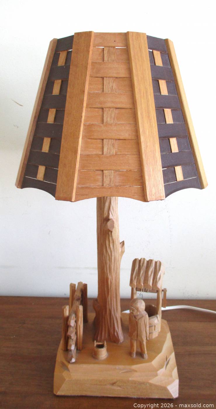 Hand-carved wooden table lamp signed Paul-Émile Caron | Maxsold