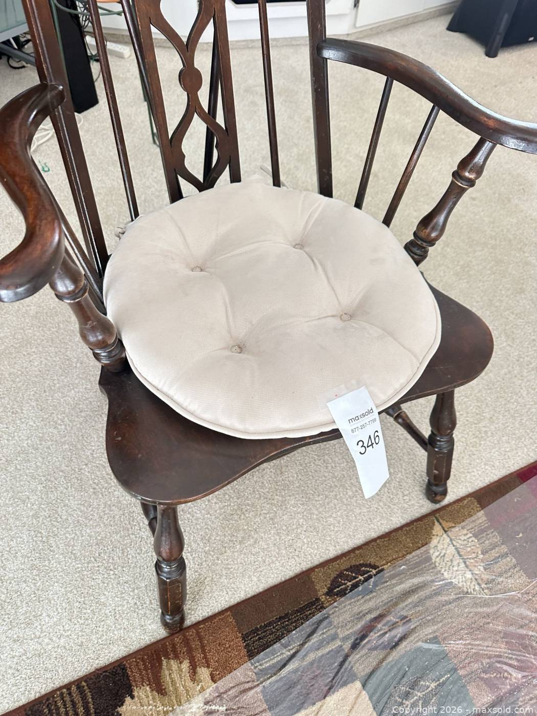 Michigan Chair Company wooden armchair and patterned area rug | Maxsold