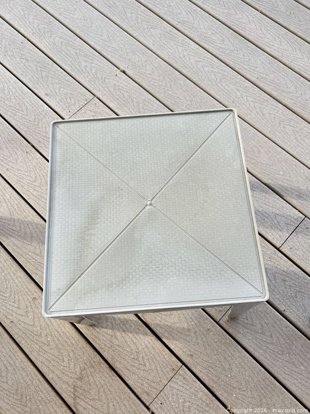 Three plastic resin outdoor side tables | Maxsold