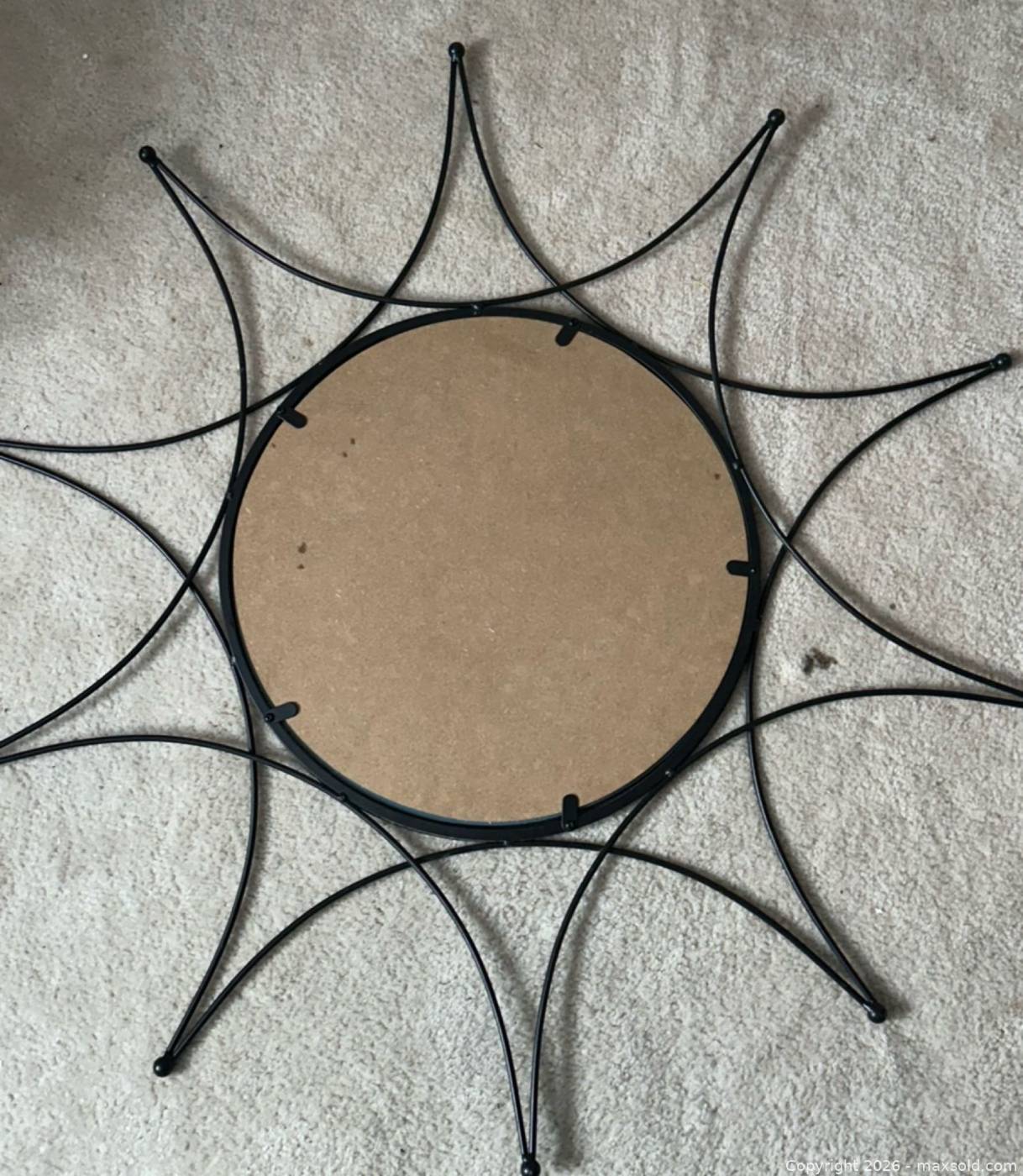 Atomic style black metal round wall mirror | Maxsold