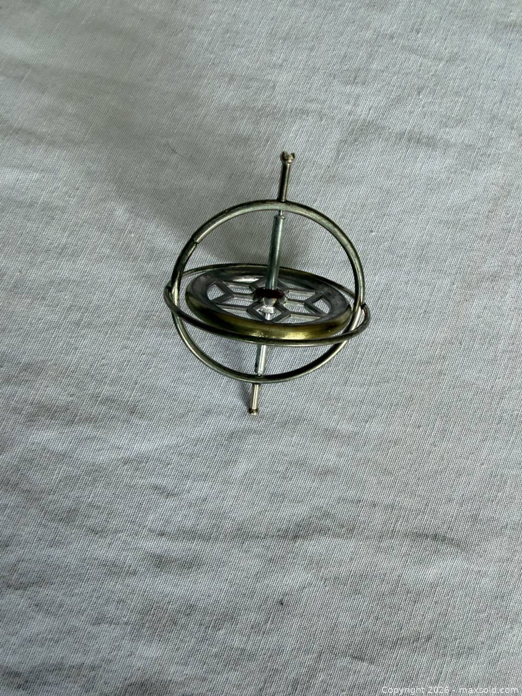 Vintage metal moon satellite gyroscope toy | Maxsold