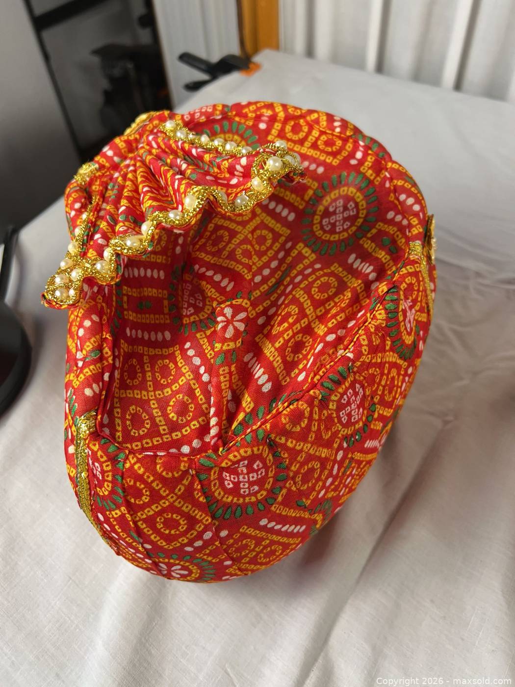 Three Red Patterned Turbans With Gold Trim | Maxsold