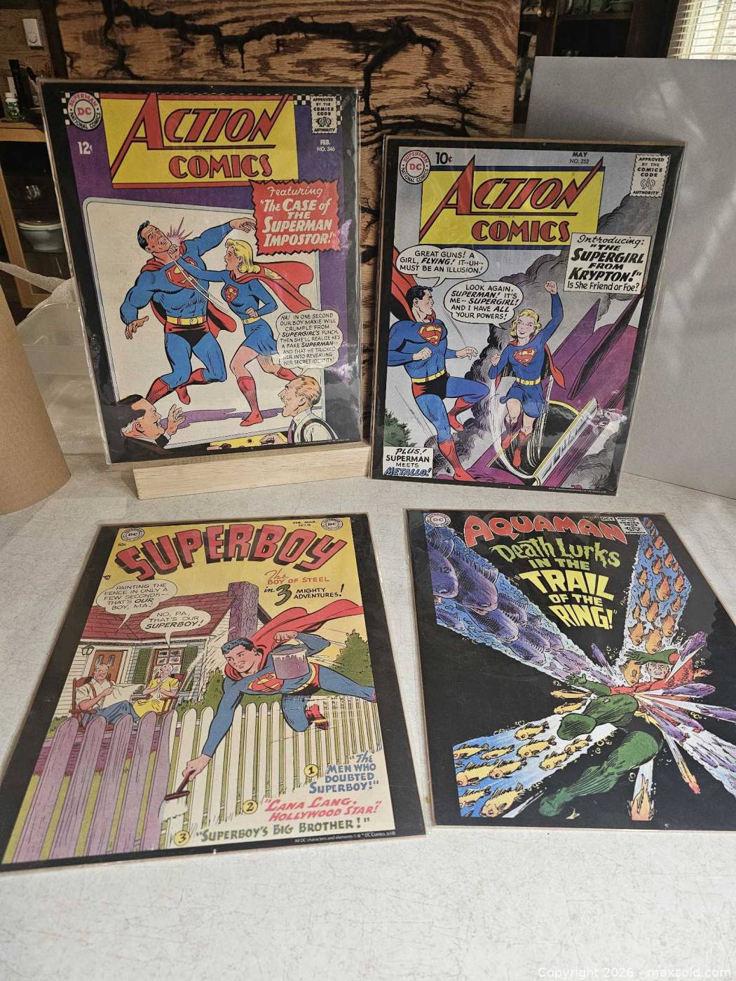 Four 11x14 DC Comics cover posters | Maxsold