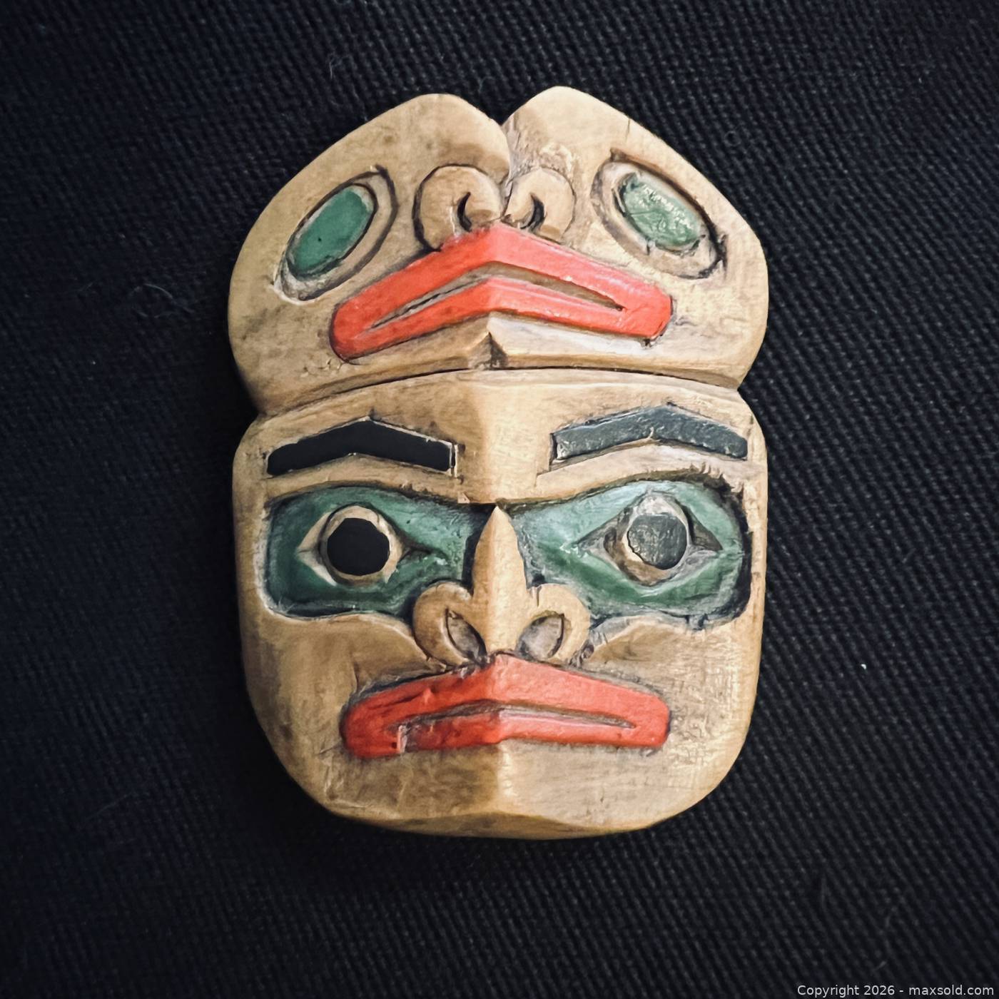Artie George hand-carved frog mask brooch | Maxsold