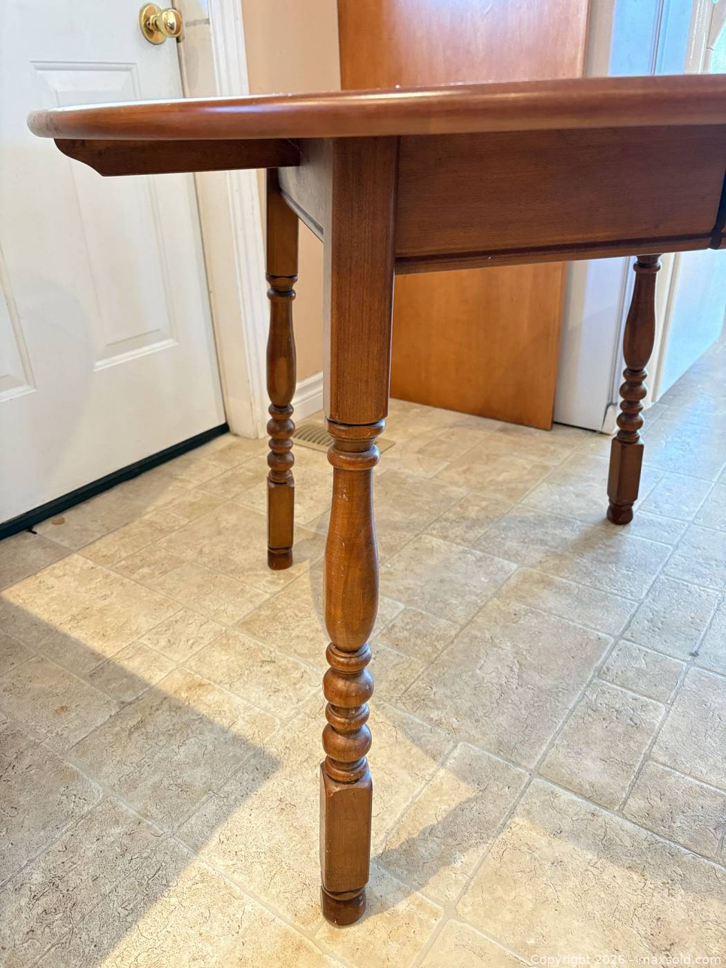 Round solid wood kitchen table with 18-inch leaf | Maxsold