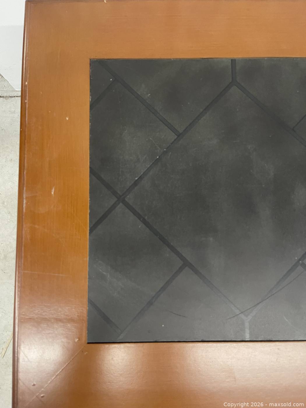 Wood end table with black tile inset | Maxsold