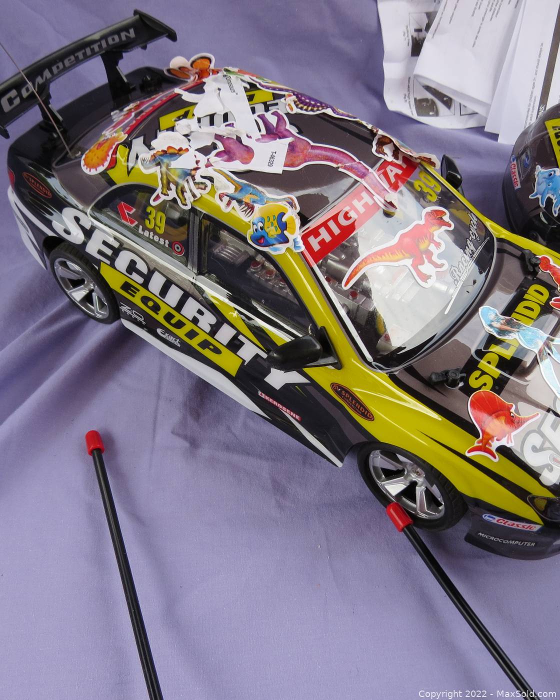 Three Remote Control Race Cars with Controllers | Maxsold