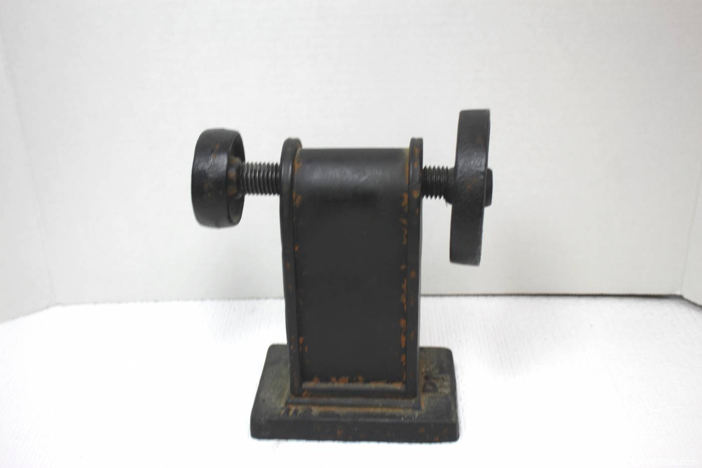 Heavy Iron Piece with Two Rotating Wheels on Base | Maxsold