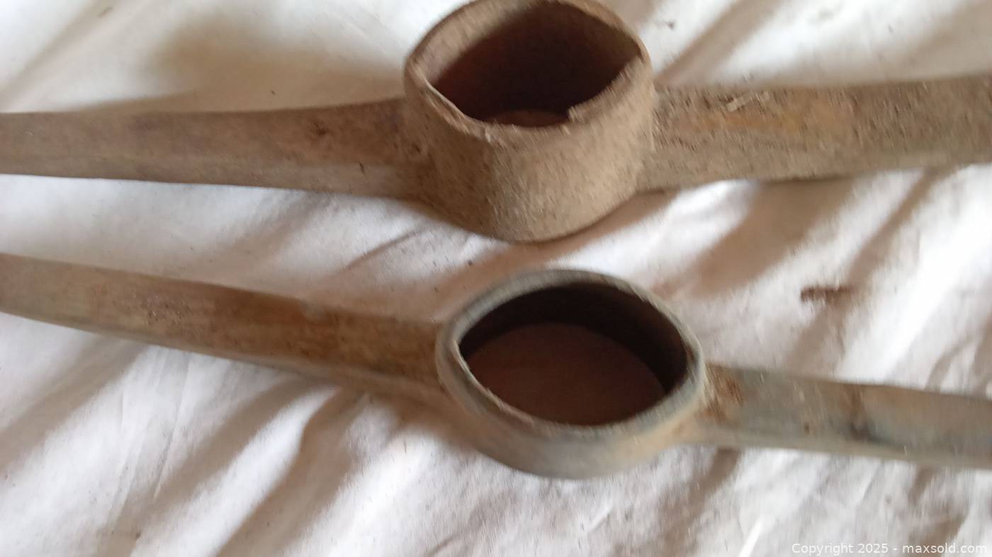 Two forged steel pick axe heads | Maxsold