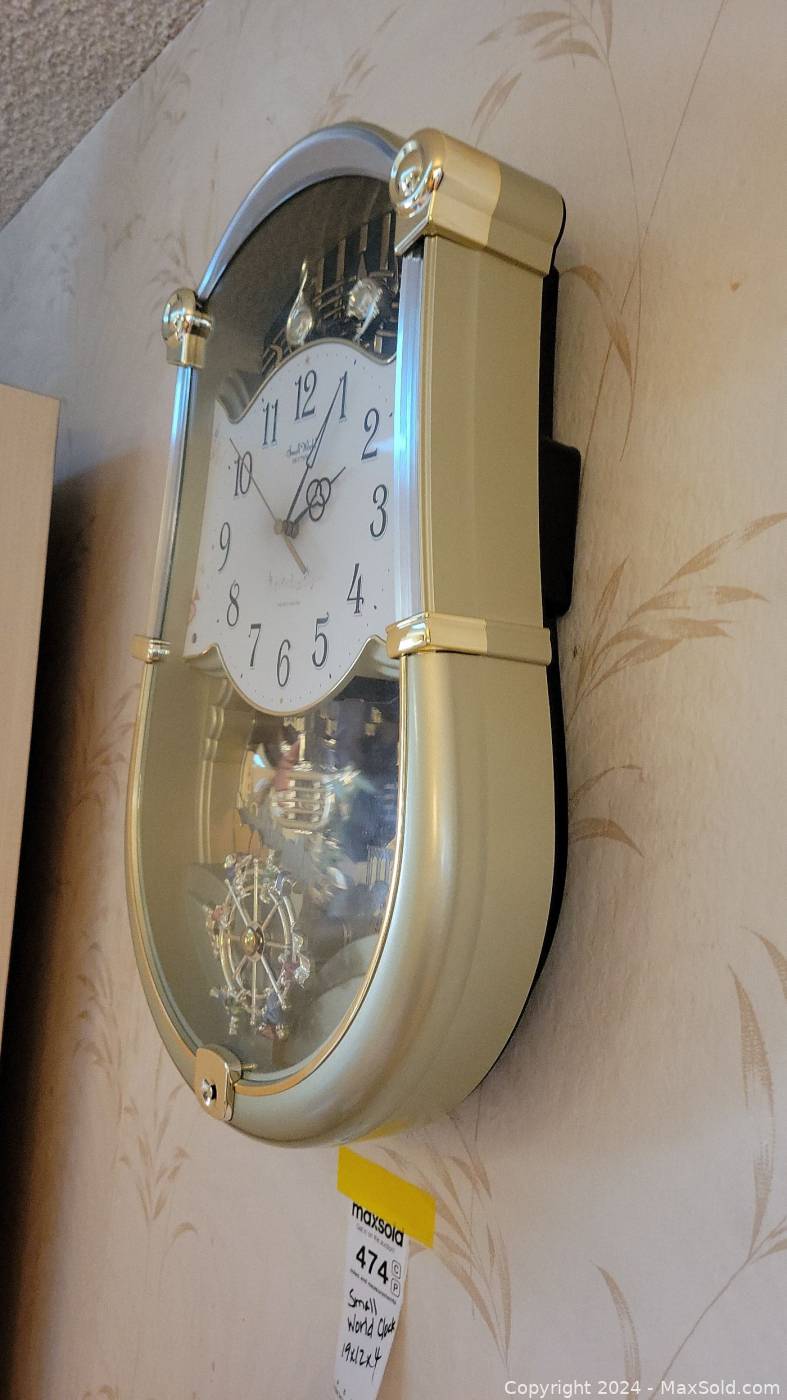 Small World Rhythm Wall Clock | Maxsold