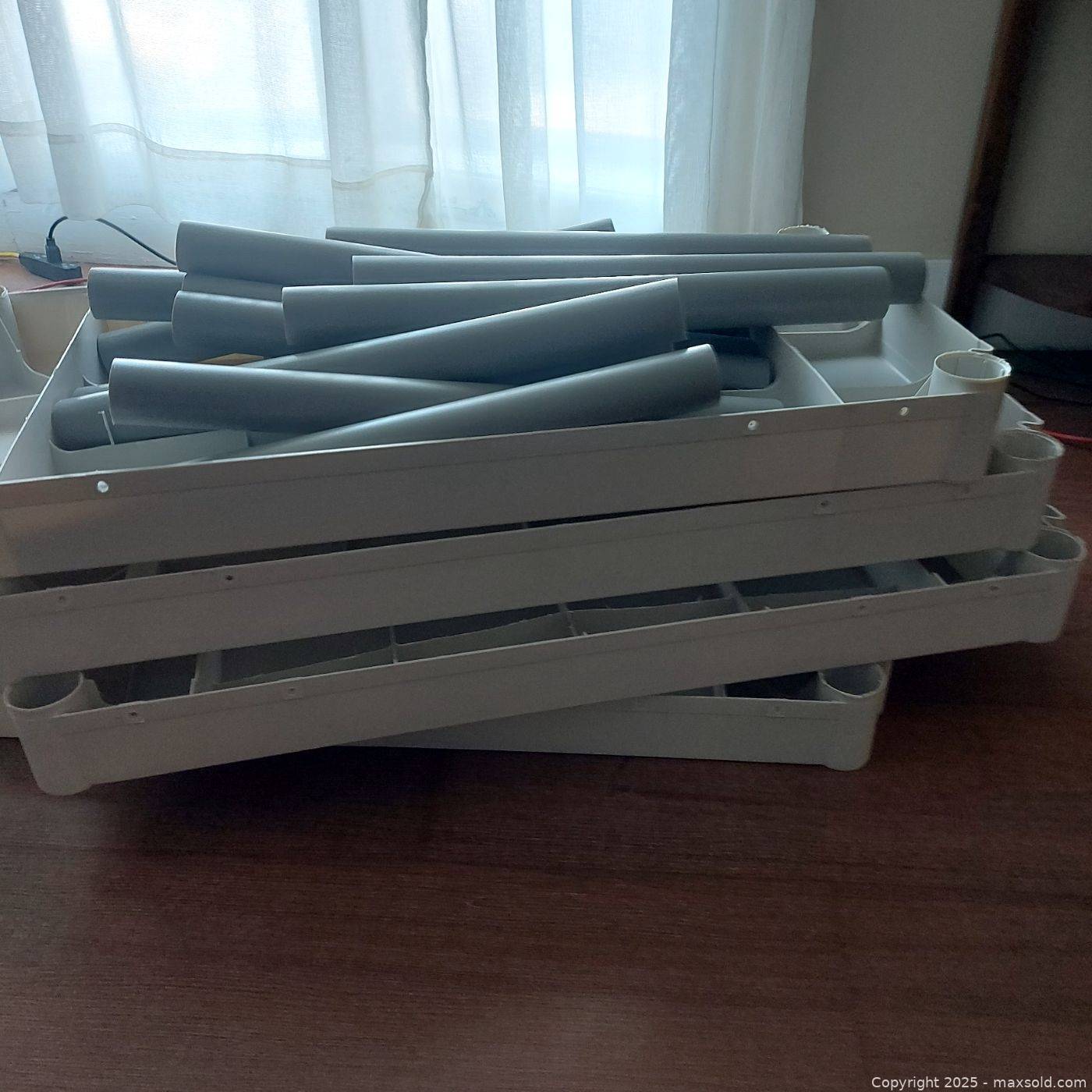 Four-tier plastic shelving rack 4 ft tall | Maxsold