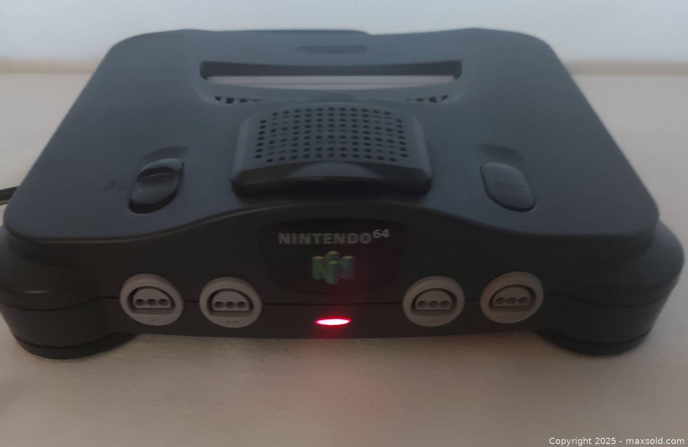1996 Nintendo 64 video game console with power and AV cables | Maxsold