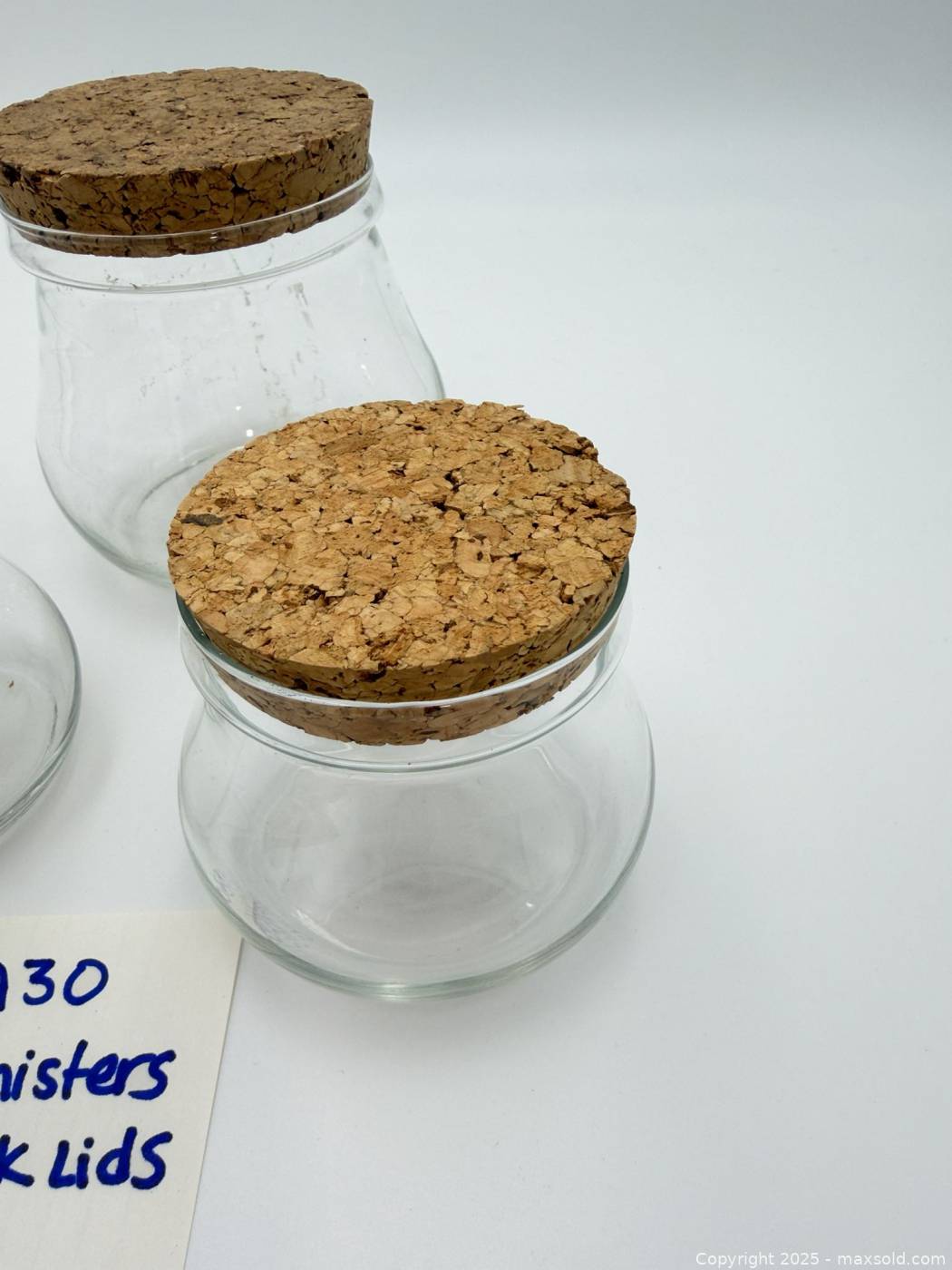 3 glass canisters with cork lids | Maxsold