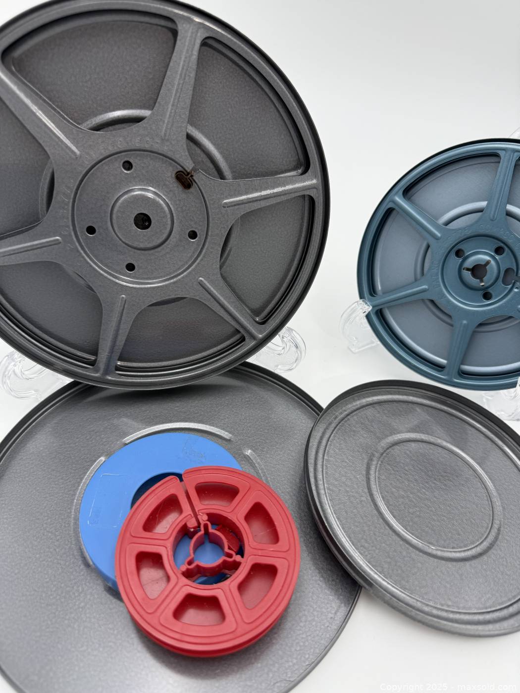 Set of three 8mm film reels with cans | Maxsold