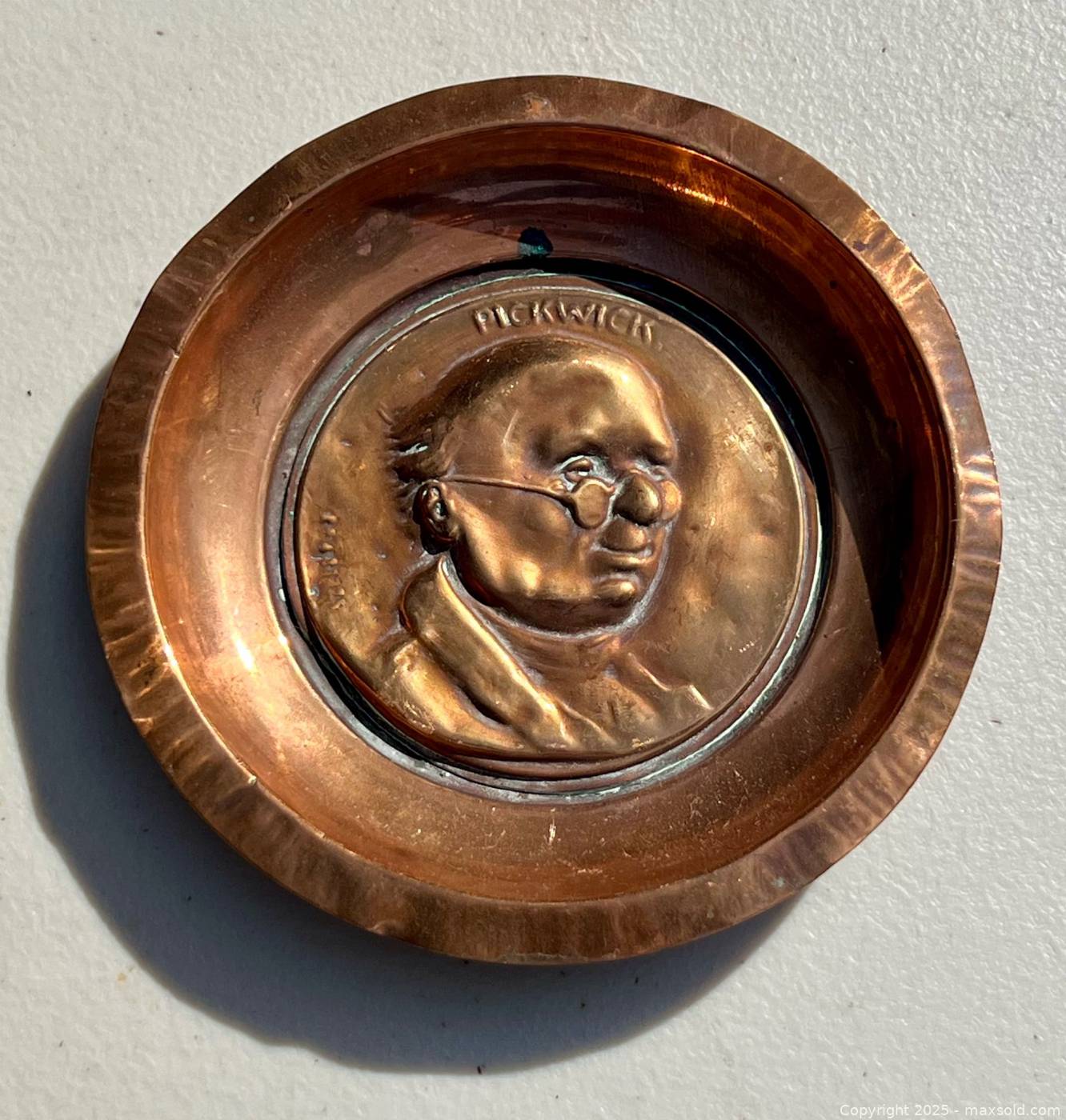 Pair vintage copper Dickens character ashtrays | Maxsold