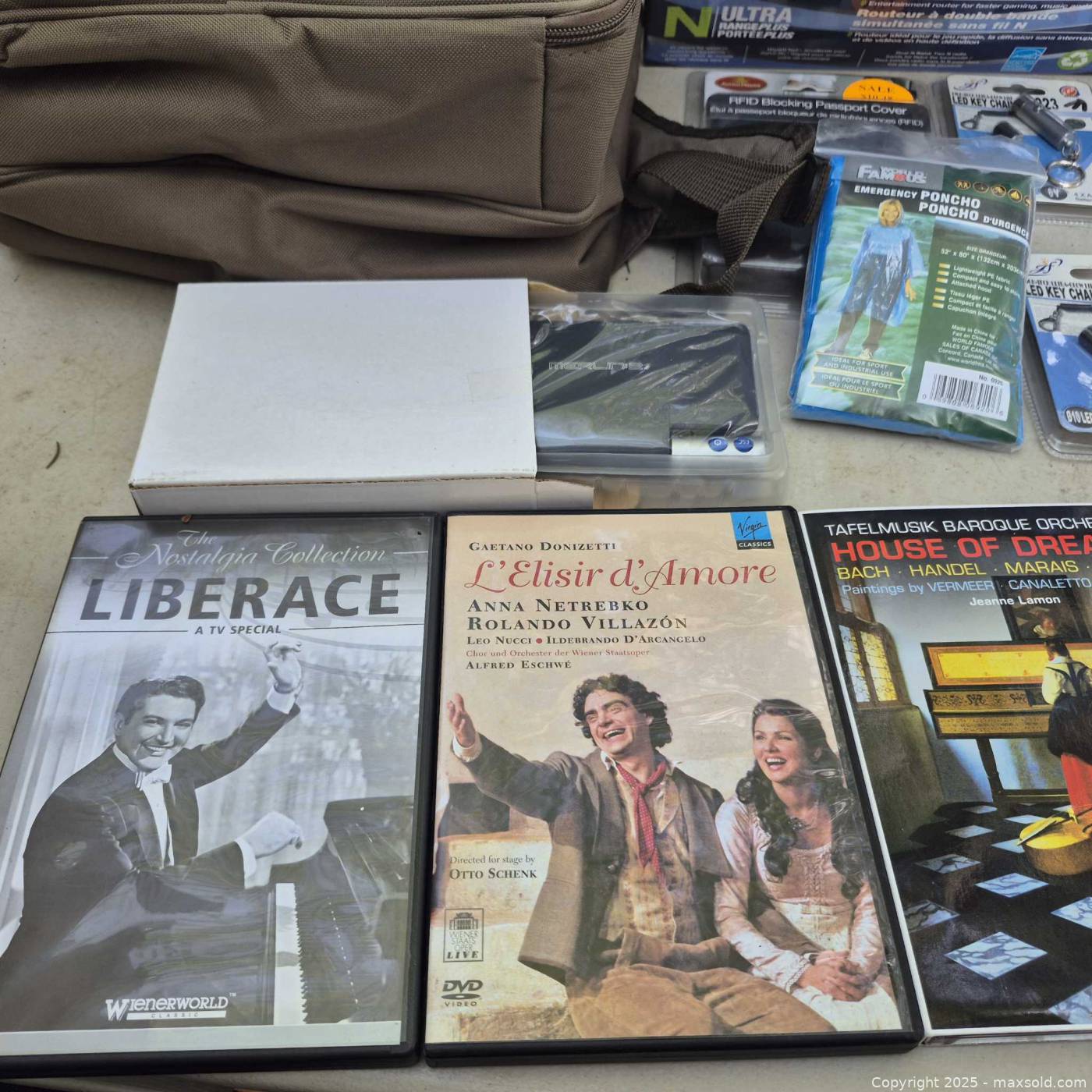 Linksys dual-band router, picnic kit, VTech MobiGo games, DVDs, hats ...