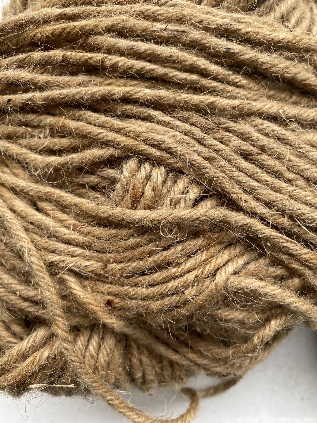 Large 1/8 in jute roll and thinner jute spool | Maxsold