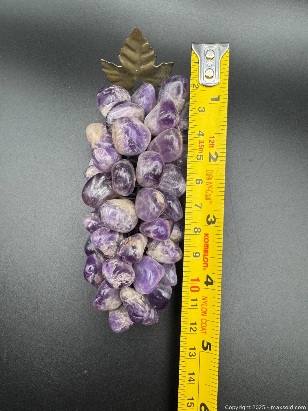 Polished amethyst grape cluster with metal leaf | Maxsold